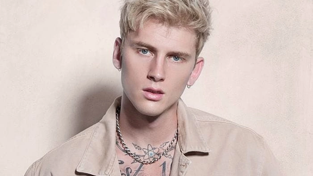Machine Gun Kelly climbs 'The Dirt' billboard for the ultimate photo-op
